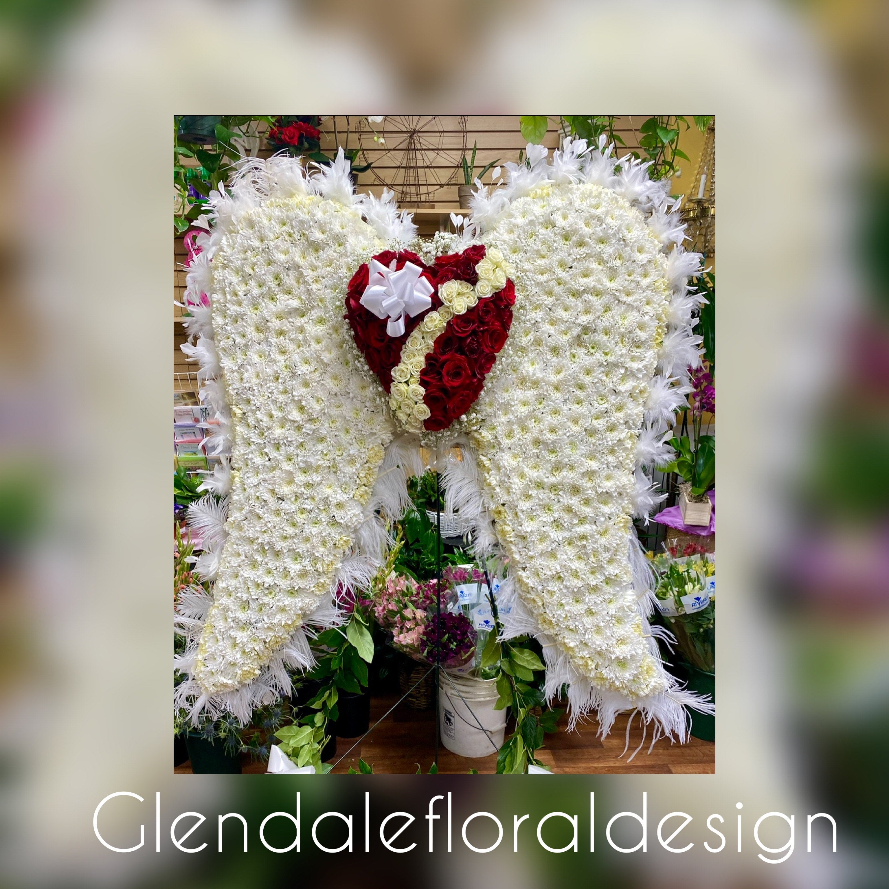 Angel wings with rose heart | Glendale Floral Design