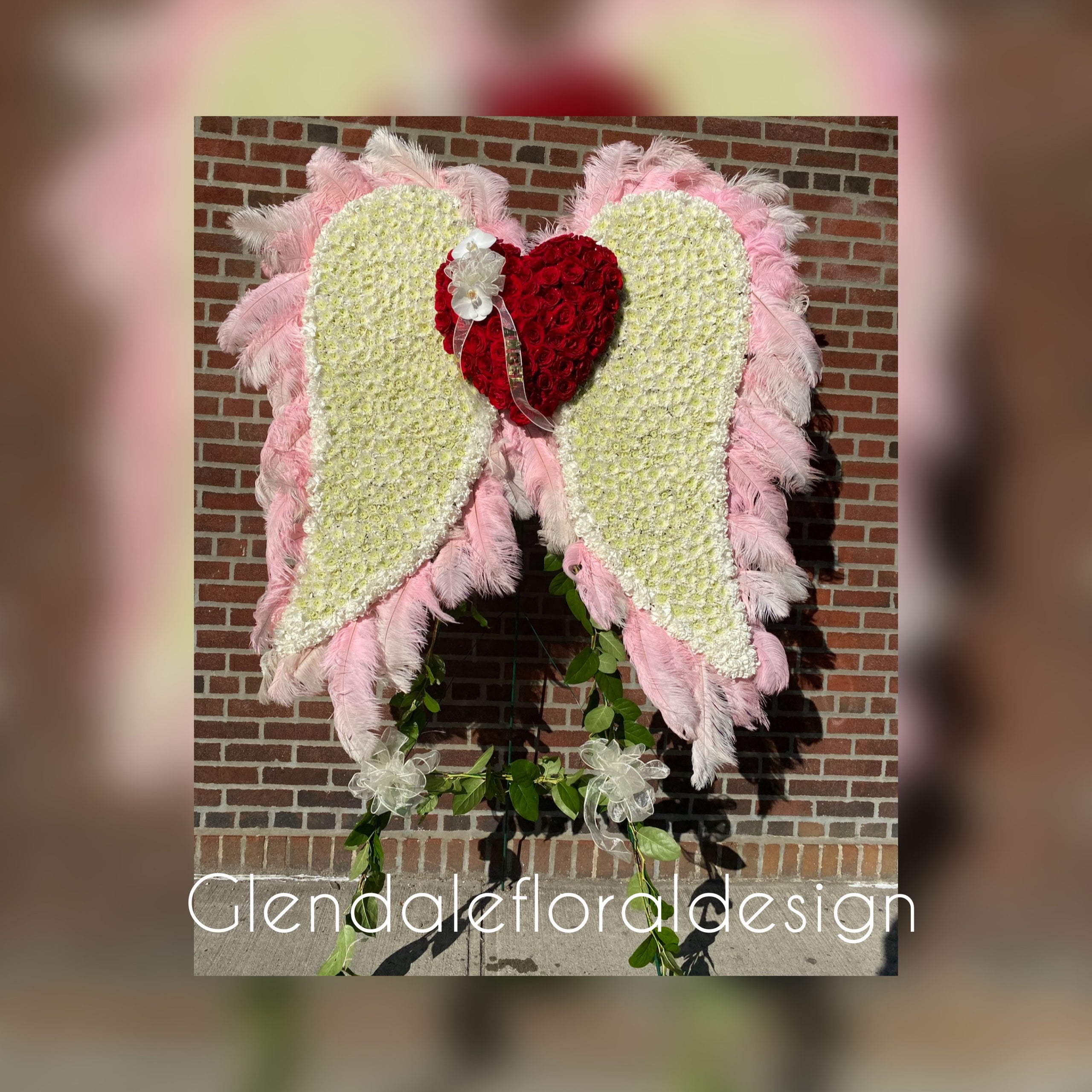 Angel wings with pink feathers | Glendale Floral Design